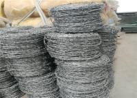 China Hot Dipped Galvanized Razor Barbed Wire Concertina Coil 1.6mm with 3-6 Inch Barb Spacing Options for sale