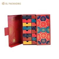 China Custom Luxury 24 Drawer Advent Calendar Box with Vintage Gold Foil Decoration and Flip Side Support Structure for sale