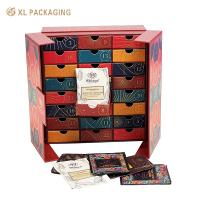 China Custom Luxury 24 Drawer Advent Calendar Box with Vintage Gold Foil Decoration and Flip Side Support Structure for sale