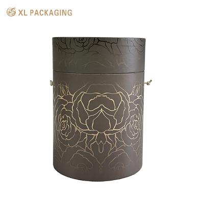 China Portable Rope Handle Paper Tube Packaging with 157gsm Art Paper and Customizable Luxury Printing for Premium Gifts for sale