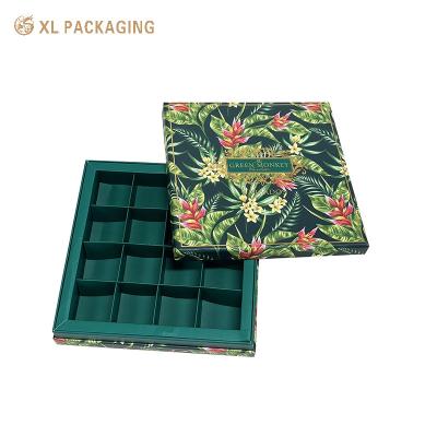 China Eco-Friendly 16 Cavity Chocolate Packaging Box with Gold Foil Logo and Floral Design for sale