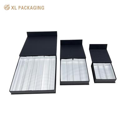 China Custom Luxury Black Chocolate Box White Logo Magnet Gift Box With Paper Dividers for sale