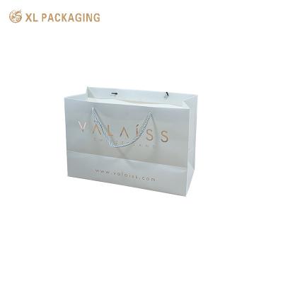 China XL Packaging Custom Logo Hard White Art Paper Bags  Luxury Shopping Packaging With Die-Cut Handles Scratch-Resistant Coating Easy Carry Design Durable For Heavy Gifts Stylish For Branded Experiences for sale