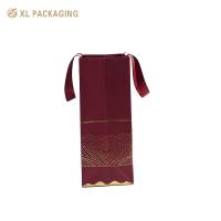 China Premium Matte Burgundy Wine Paper Gift Bag with Oriental Gold Foil Stamping and Rivet Reinforced Satin Ribbon Handles for sale