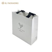 China XL Packaging Custom Packaging Factory Customized Luxury Printing Paper Bag Gift Paper Packaging Paper Bag with the Custom Logo Cloth Package Shipping Bag for sale