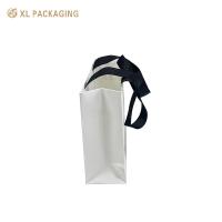 China XL Packaging Custom Packaging Factory Customized Luxury Printing Paper Bag Gift Paper Packaging Paper Bag with the Custom Logo Cloth Package Shipping Bag for sale
