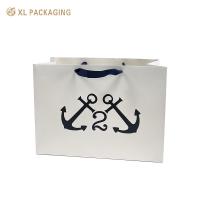 China XL Packaging Custom Packaging Factory White Paper Packaging Bags Gold Foil Kraft Paper Clothes Shoes Shopping Bag With Handle for sale