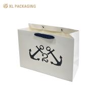 China XL Packaging Custom Packaging Factory White Paper Packaging Bags Gold Foil Kraft Paper Clothes Shoes Shopping Bag With Handle for sale