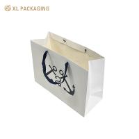 China XL Packaging Custom Packaging Factory White Paper Packaging Bags Gold Foil Kraft Paper Clothes Shoes Shopping Bag With Handle for sale