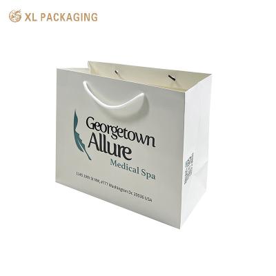 China XL Packaging Custom Company Logo Paper Shopping Bags High Quality Coated Paper Hand Bags For Clothes Shoes Retail Packaging Sturdy Handles Gloss Matt Lamination & Bulk Order Discounts for sale