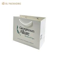 China XL Packaging Custom Company Logo Paper Shopping Bags High Quality Coated Paper Hand Bags For Clothes Shoes Retail Packaging Sturdy Handles Gloss Matt Lamination & Bulk Order Discounts for sale