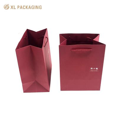 China XL Packaging Custom Packaging Factory Folder Paper Bag Wine Red Color Coated Paper Hand Bag For Gift Box Packaging Gift Shipping Bag With Your Own Logo for sale