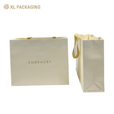 China XL Packaging Custom Packaging Factory Warm Color Paper Packaging Bags Eco friendly For Exhibition Promotion Events for sale