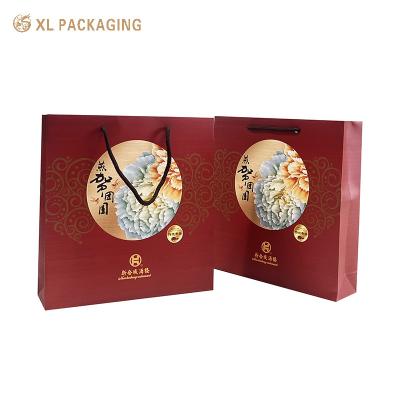 China Premium Custom Paper Bags with Black Handles – Eco-Friendly & Matte Lamination for Hotels and Retail for sale