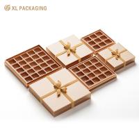 China Embossed Custom CMYK Packaging Chocolate Candy Lid Base Artpaper Box with Ribbon Base for sale