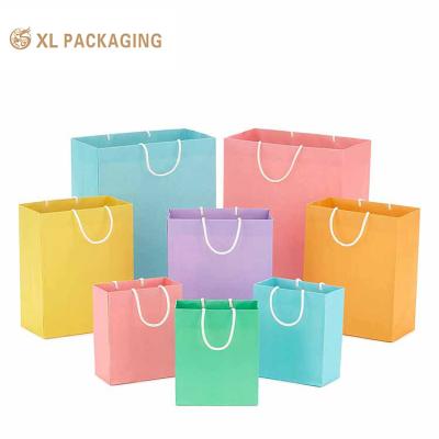 China Large recyclable luxury custom logo paper shopping bags with twisted paper handles for sale