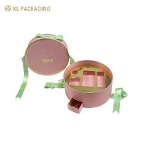 China XL Packaging Custom Printed Cosmetic Boxes Custom Luxury Boxes WholesalRound Cosmetic Paper Box With Unique Design Mini Drawer Box Green Ribbon Handle And Gold Tray For Beauty Essentials for sale