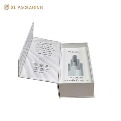 China ﻿XL Packaging Custom Printed Cosmetic Boxes Embossed Black Foil Logo Kraft Paper Packaging Box for Eco Friendly Skincare Products for sale