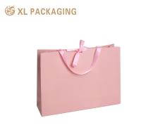 China XL Packaging Luxury Pink Boutique Shopping Paper Gift Bag 250G Gsm Cardboard Packaging Bags With Your Own Logo Print Handle for sale