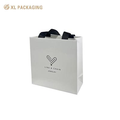 China XL Packaging Custom Packaging Box Factory Wholesale Custom Pantone Color Disposable Hotel Using Paper Bag With Golden Strings Handle for sale