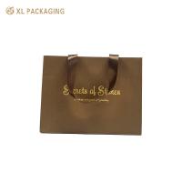 China XL Packaging Custom Packaging Box Factory Wholesale Custom Pantone Color Disposable Hotel Using Paper Bag With Golden Strings Handle for sale