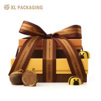 China Luxury Textured Paper Chocolate Gift Box with Embossed Logo Elastic Tag and Easy Open Lid for sale