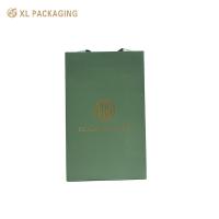 China XL Packaging Custom Packaging Factory Custom Design Printed Shopping Gift Packaging Paper Bag With Your Own Logo Luxury Green Ribbon Thick Paper Bag For Clothes for sale