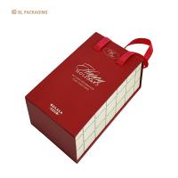China Custom Magnetic Closure Box Red Yellow Printing Ribbon Handle Foam Insert for sale