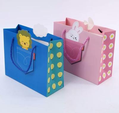 China handling reusable high quality hot stamping black hand hard paper bag for birthday gifts packaging for sale