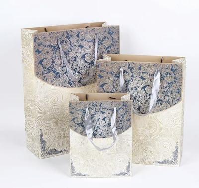 China Custom made full color laminated shopping paper bag with logo print for sale