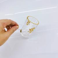 China Elegant Gold Ginkgo Leaf Heat-Resistant 90g Capacity Glass Tea Cup For Tea And Coffee Drinkware for sale