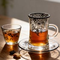 China Elegant Glass Tea Cups made from durable heat resistant glass ideal for serving vibrant flower teas coffee and espresso in hospitality settings for sale