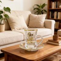 China Top Mouth Diameter 54MM Clear Glass Tea Cup Set 6pcs Turkish Cups 6pcs Saucers Featuring Artistic Decal And Pearl Decoration Ideal For Tea Presentation for sale