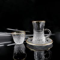 China Elegant Gold Rim Embossed Glass Tea Cup with Saucer Arabic Turkish Style Glass Tea Cup Premium Quality Luxury Glassware for Tea & Coffee for sale