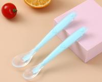 China Ergonomic Silicone Spoon with Hanging Hole Dishwasher Safe Pink or Blue for sale