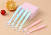China Ergonomic Silicone Spoon with Hanging Hole Dishwasher Safe Pink or Blue for sale