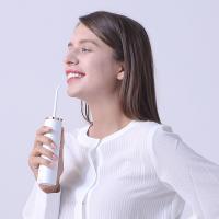 China Magnetic Suction Charging Water Flosser 800mAh IPX7 Portable Oral Irrigator 80ml Tank for sale