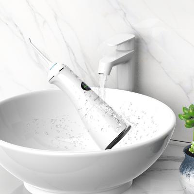 China Nicefeel IPX7 Oral Irrigator 300ml Water Tank Home Use Water Flosser with 1400mAh Battery for sale