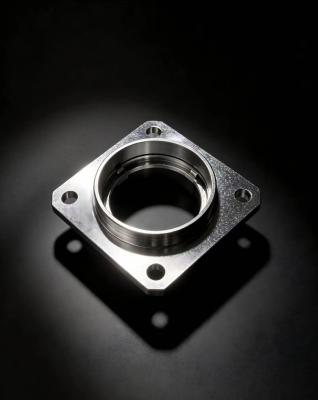 China Turn-Mill CNC Expert - Square Flange Aluminum Connector Housing with Multi-Step Bore and Locating Slots for Precision Sealing Assembly for sale