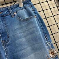 China Women's Bootcut High Waist Flared Jeans Medium Blue Denim Jeans with Heavy Embroidery for sale