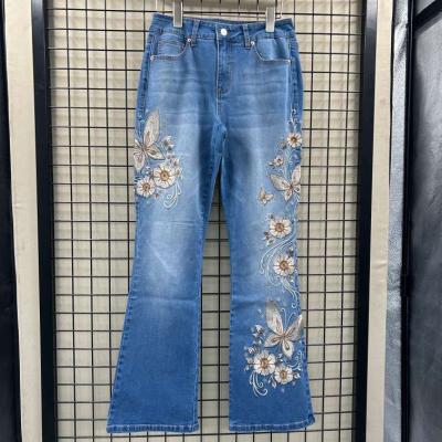 China Women's Bootcut High Waist Flared Jeans Medium Blue Denim Jeans with Heavy Embroidery for sale