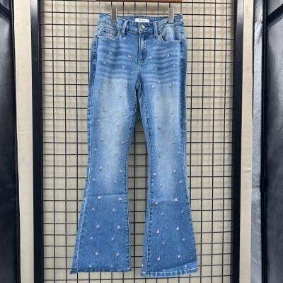 China OEM ODM Women's Stretch Bootcut Jeans , Medium Blue Sand Wash Flared Denim Jeans for sale