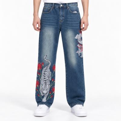 China Relaxed Fit Denim Jeans , Men'S Whiskered Sand Wash Jeans With Heavy Embroidery for sale