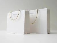 China Custom Printed Kraft Paper Carrier Bags 30gsm 160gsm with Handles for Gift Shopping for sale