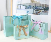 China Custom 100gsm Die Cut Paper Carrier Bags with Pantone Color Printing for sale
