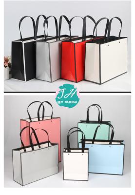 China Custom Embossed PMS Color Paper Gift Bags with Handles 1000pcs MOQ Luxury Carrier Bags for sale