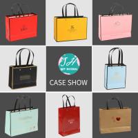 China Custom Embossed PMS Color Paper Gift Bags with Handles 1000pcs MOQ Luxury Carrier Bags for sale