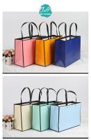 China Custom Embossed PMS Color Paper Gift Bags with Handles 1000pcs MOQ Luxury Carrier Bags for sale