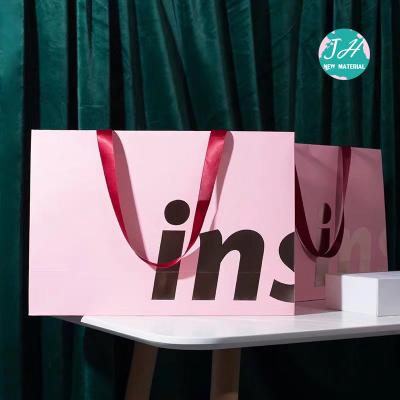 China Custom 32x10x25cm Cardboard Paper Shopping Bags with Ribbon Handle 4C Printing for sale