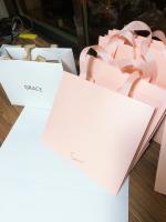 China Custom 32x10x25cm Cardboard Paper Shopping Bags with Ribbon Handle 4C Printing for sale